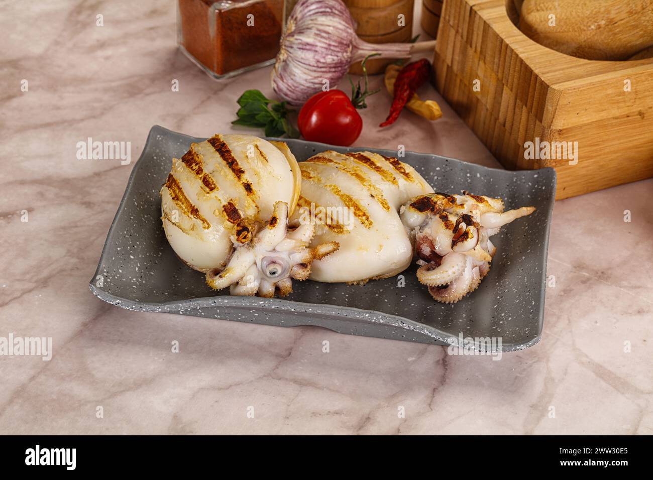 Grilled gourmet cuttlefish in the plate Stock Photo - Alamy