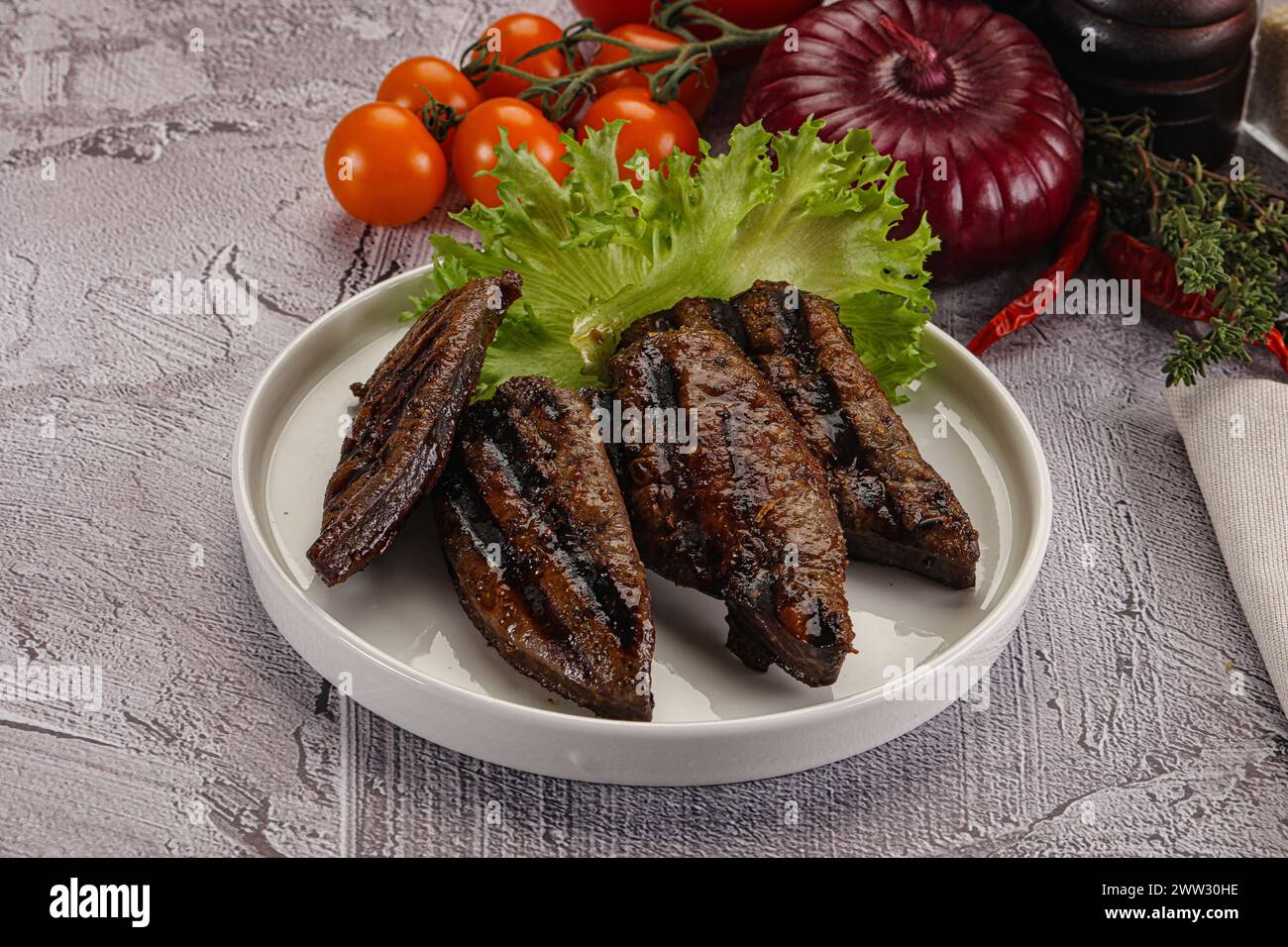 Grilled diet beef liver steak in the plate Stock Photo - Alamy