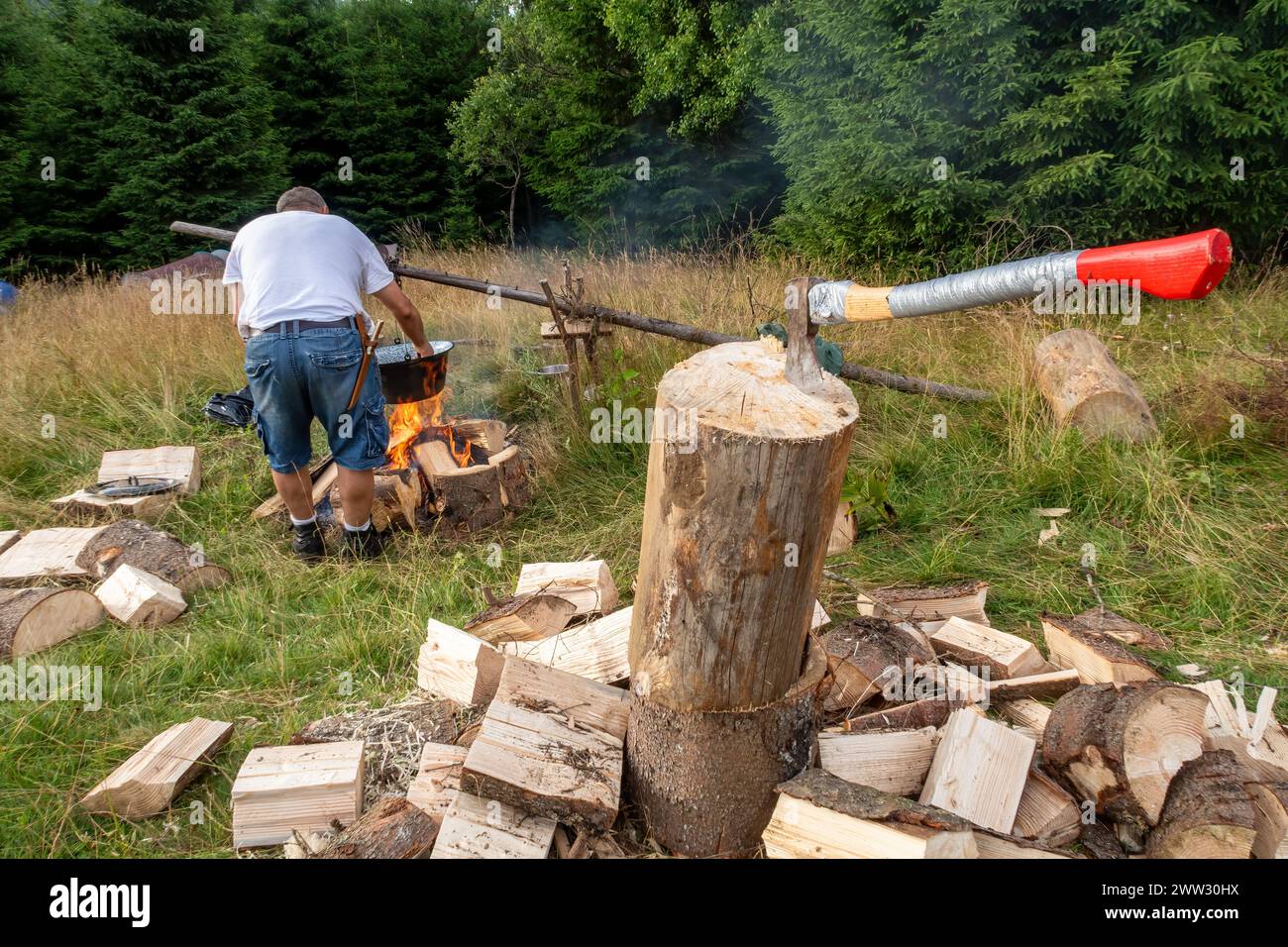 Axe for making fire wood for the campfire Stock Photo - Alamy