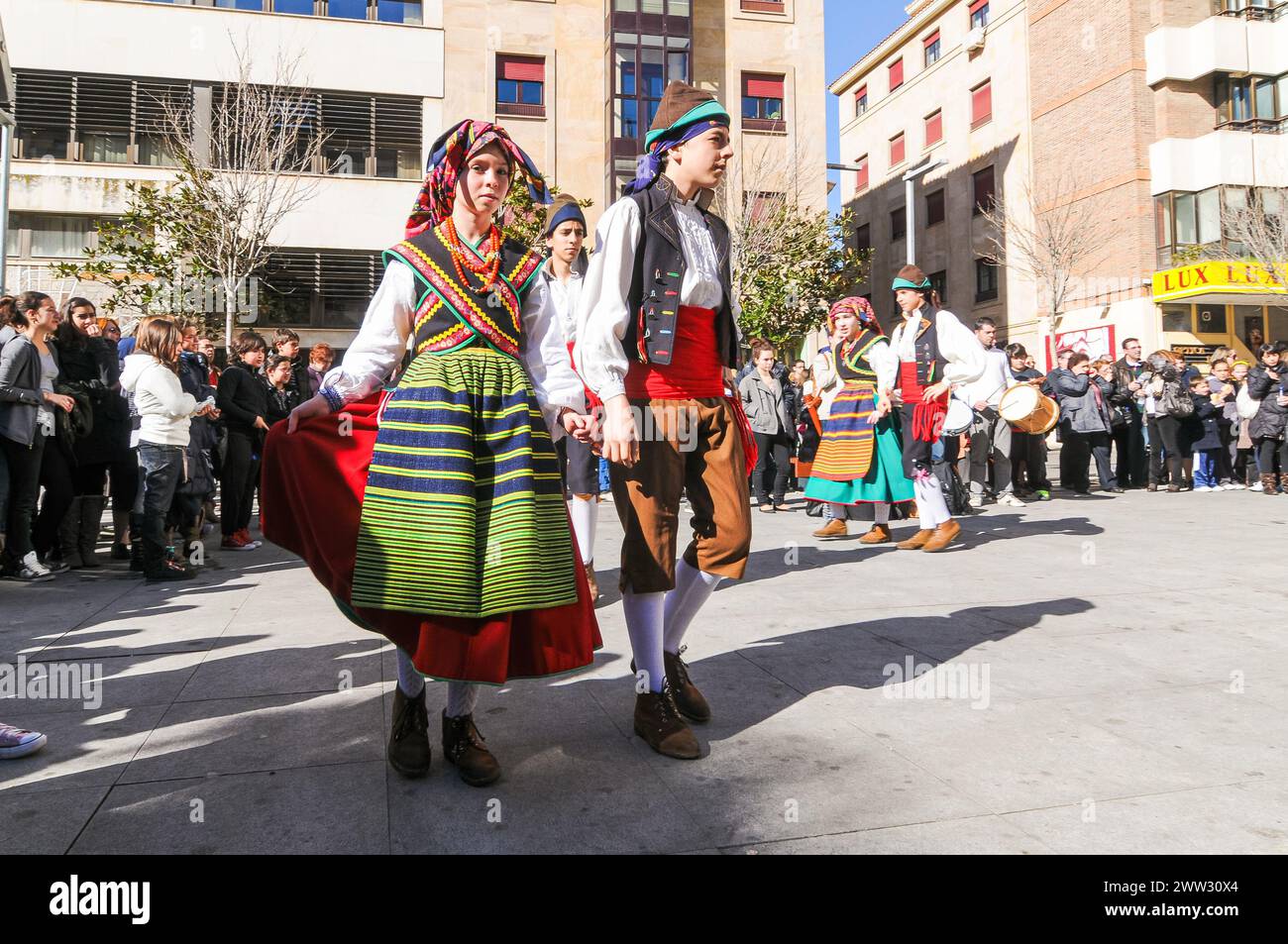 People dressed in traditional clothing perform during a celebration in ...