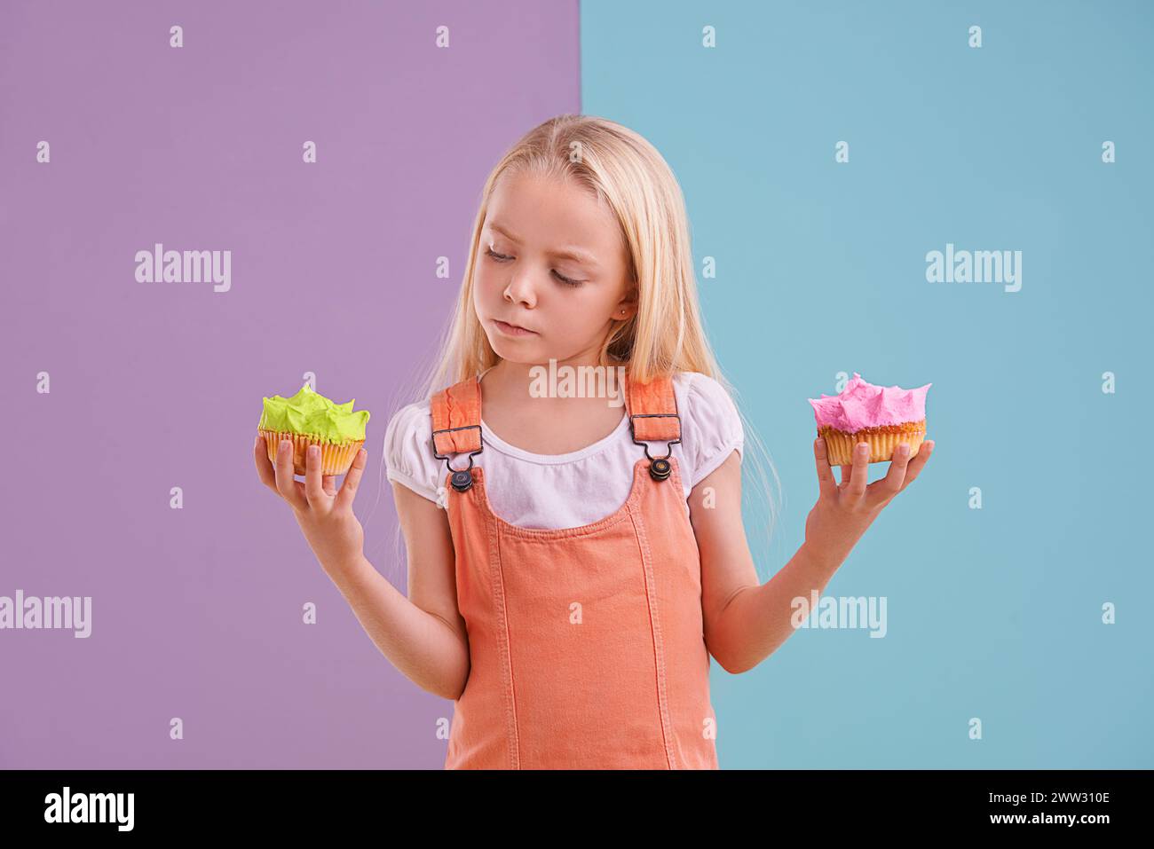 Studio, girl and choice with cupcakes, dessert and decision for snack ...