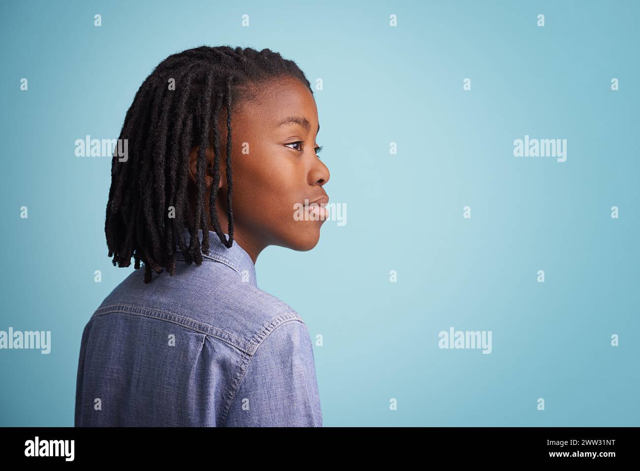 Idea, thinking and black boy kid in studio with why, questions or ...