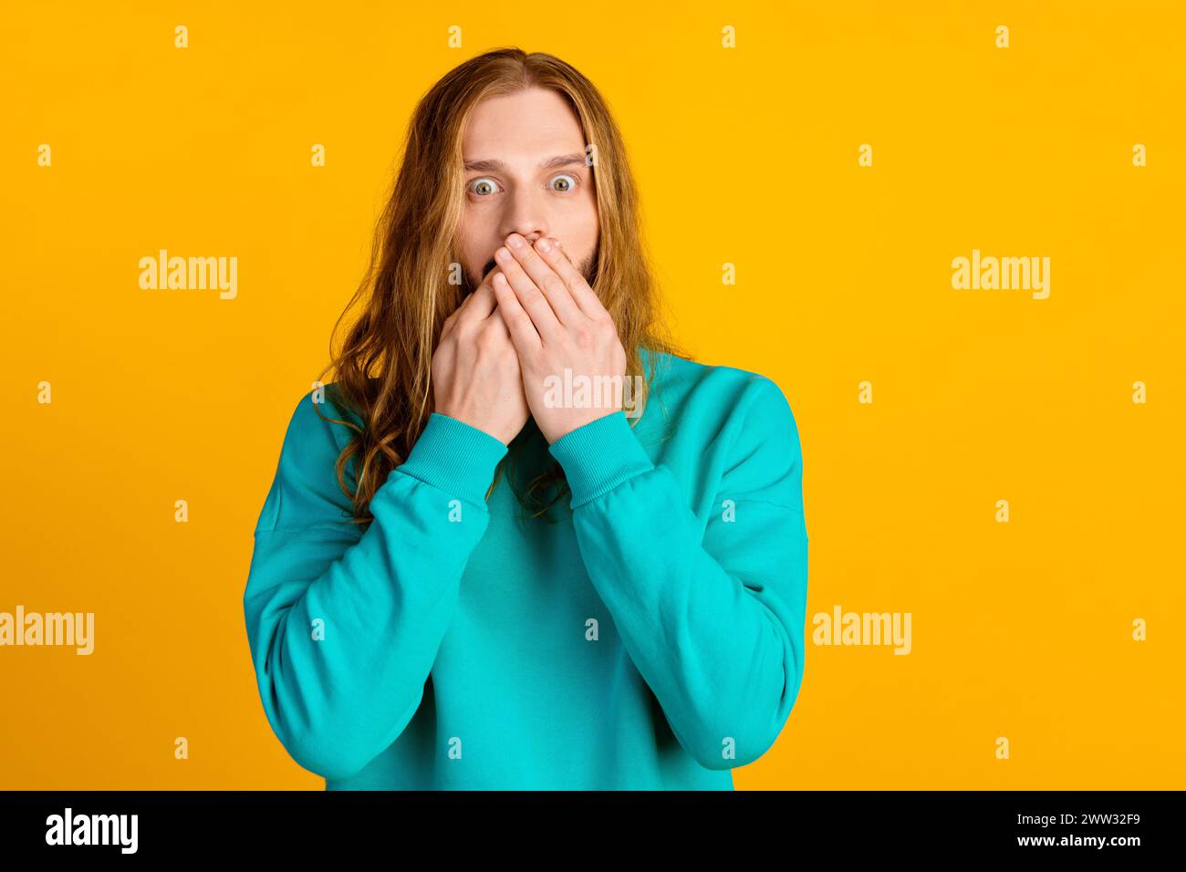 Portrait of impressed frightened person arms cover mouth stare empty ...