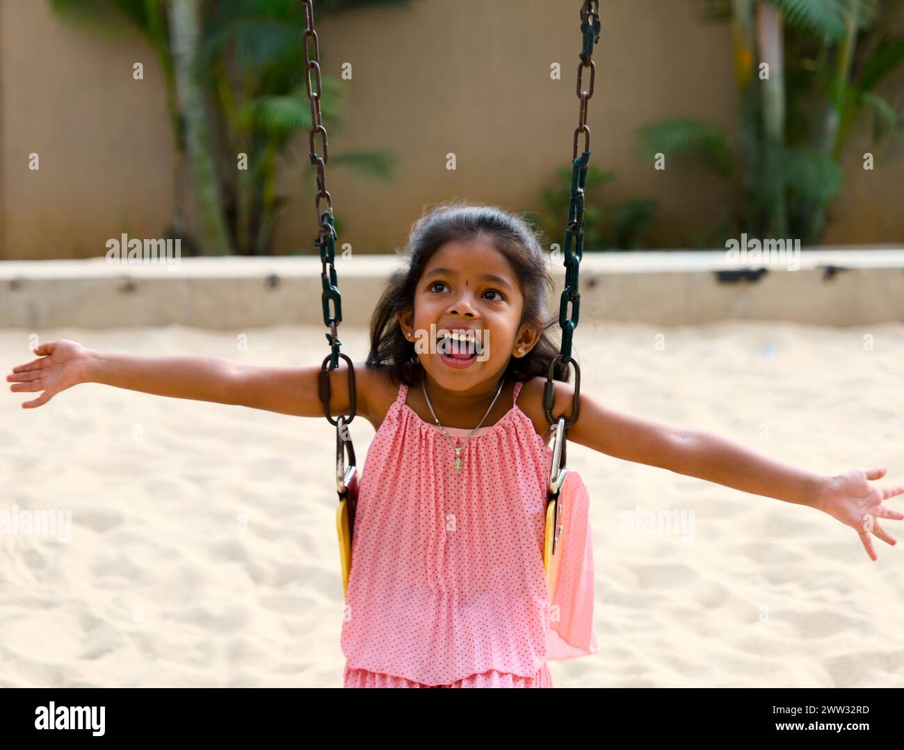 Child swinging legs hi-res stock photography and images - Alamy