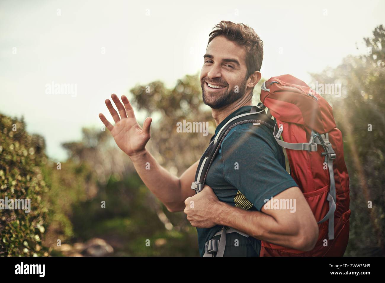 Man, hike and hi with smile for adventure with backpack for fitness ...