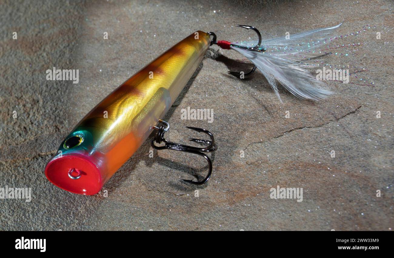 Artificial fishing lure anglers use when fish are biting on the surface ...