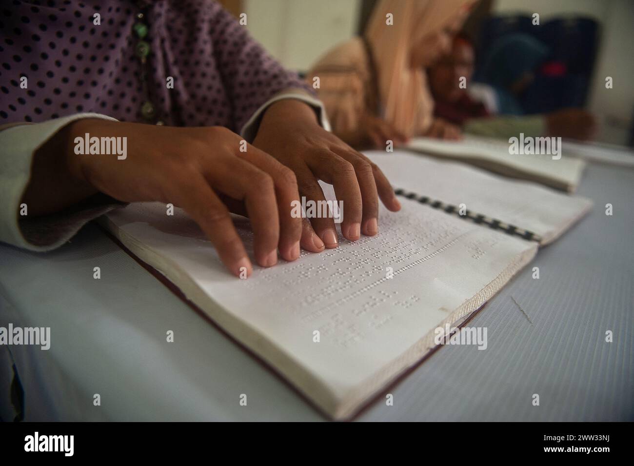 Indonesia. 21st Mar, 2024. A visually impaired woman's fingers touched ...