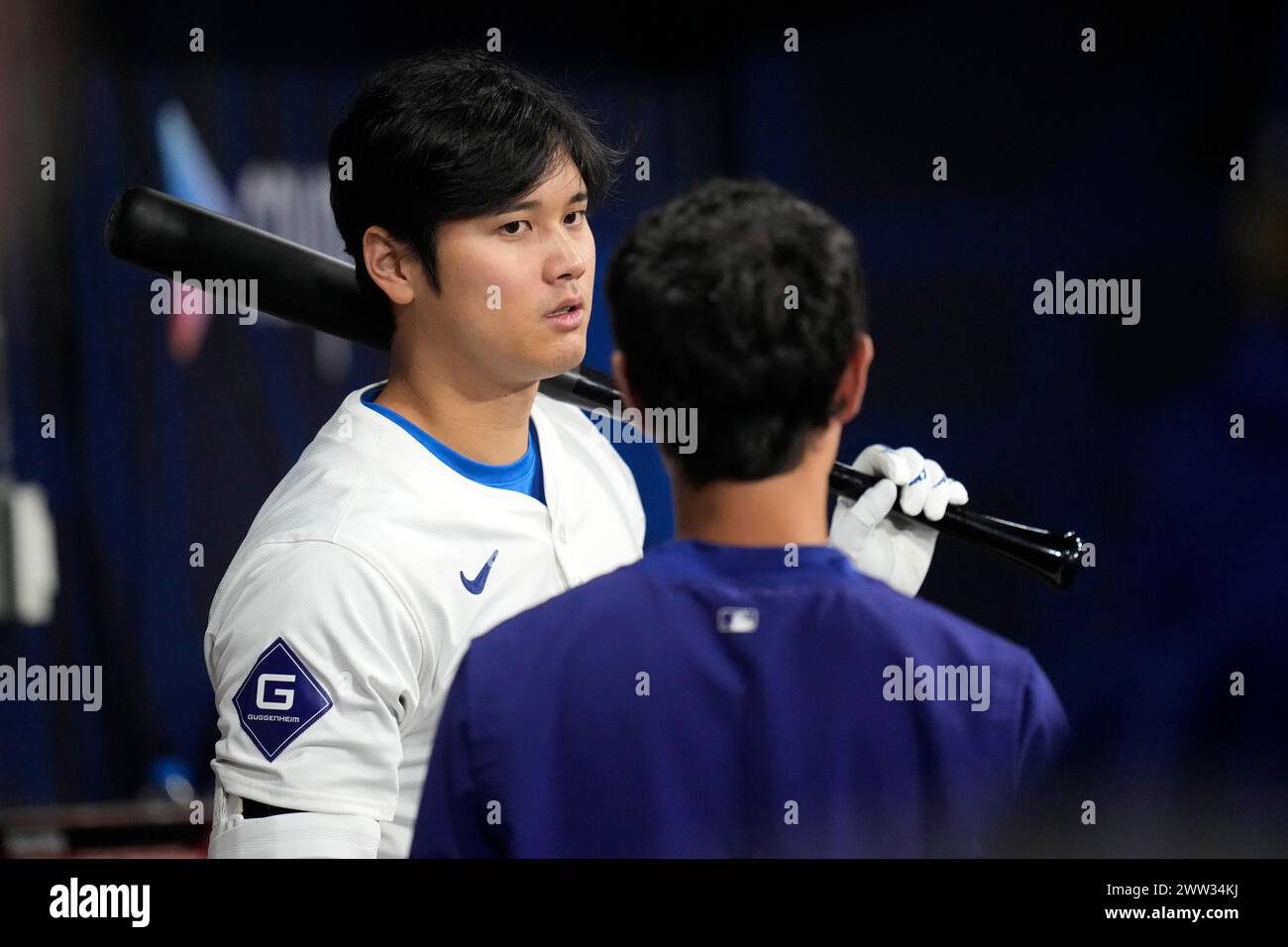 Los Angeles Dodgers designated hitter Shohei Ohtani, left, stands in ...