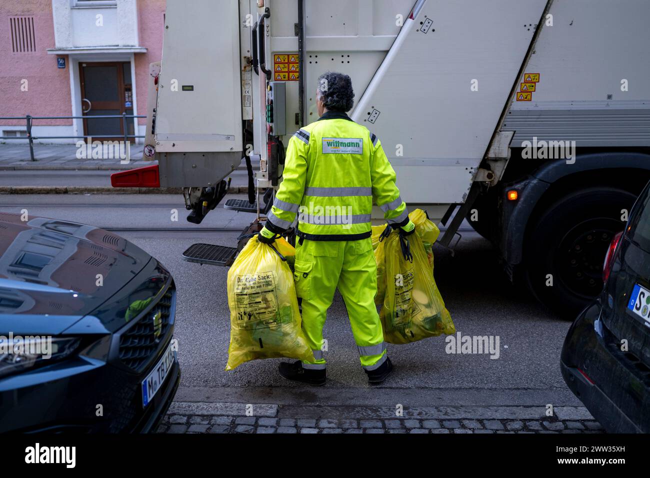 Munich, Germany. 21st Mar, 2024. An employee of the waste disposal ...