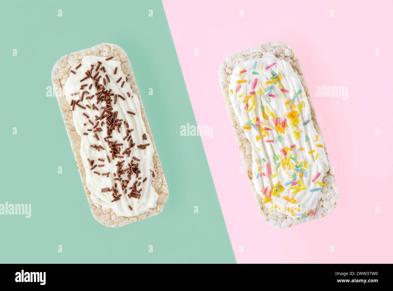 Two oblong rice cakes topped with soft cheese, chocolate and colored ...