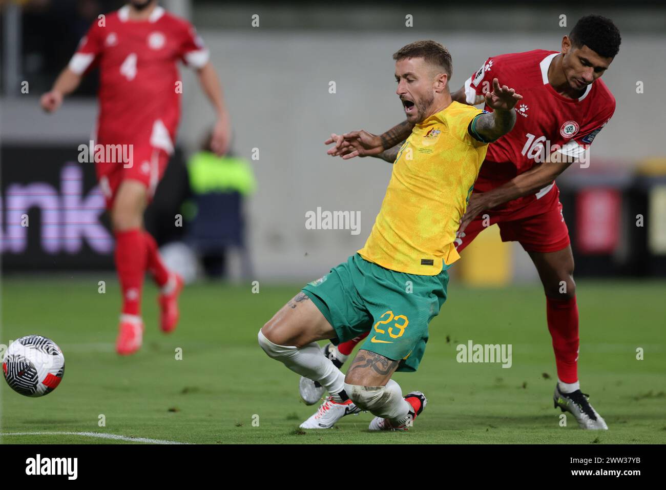 Adam Taggart of Australia attacks on goal but Walid Shour of Lebanon ...