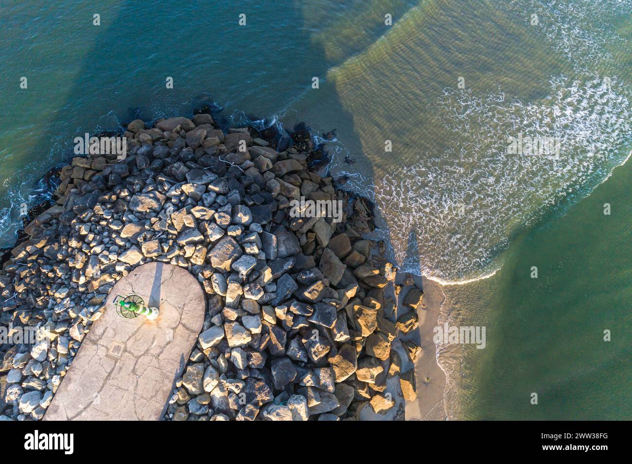drone aerial view of the end of a harbor breakwater Stock Photo - Alamy