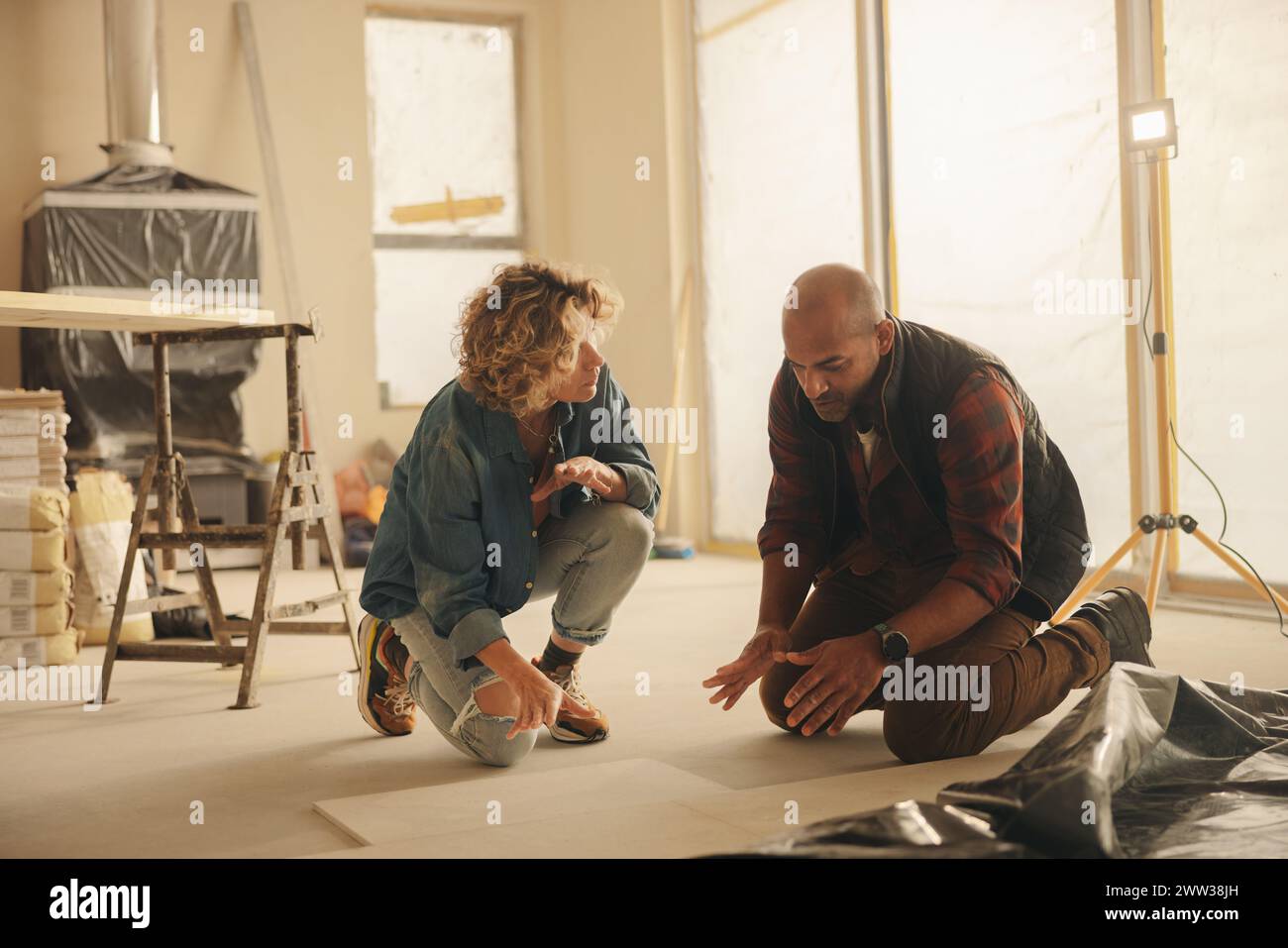 Collaborative couple working together on a DIY home renovation ...