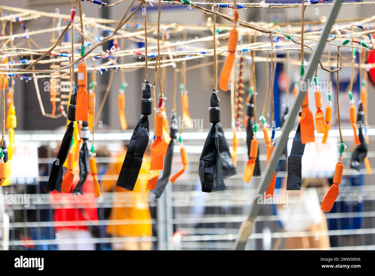 Hanging firecrackers of different colors during the mascleta, a ...