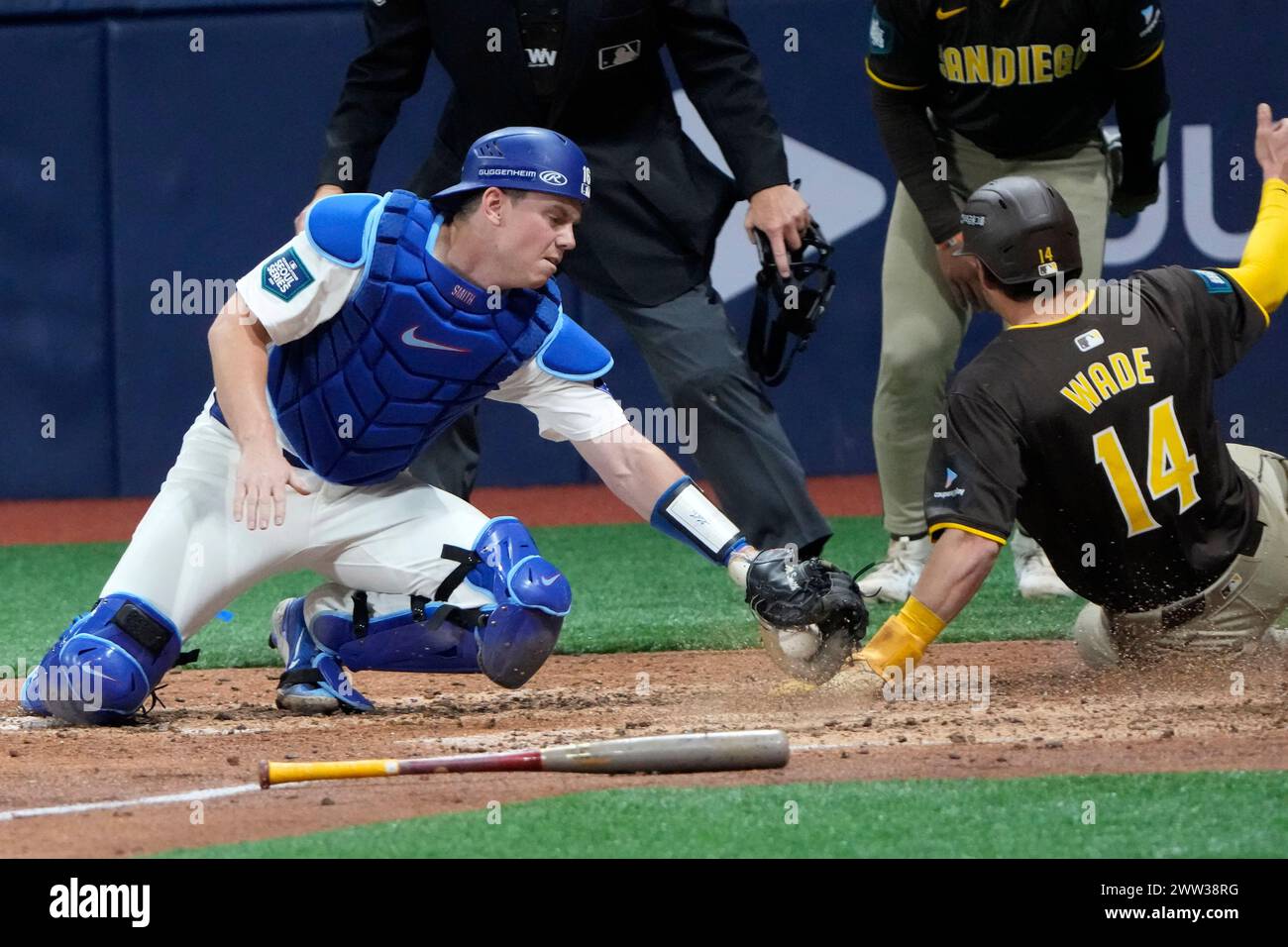 San Diego Padres' Tyler Wade, right, scores on a single by Xander Bogaerts as Los Angeles ...