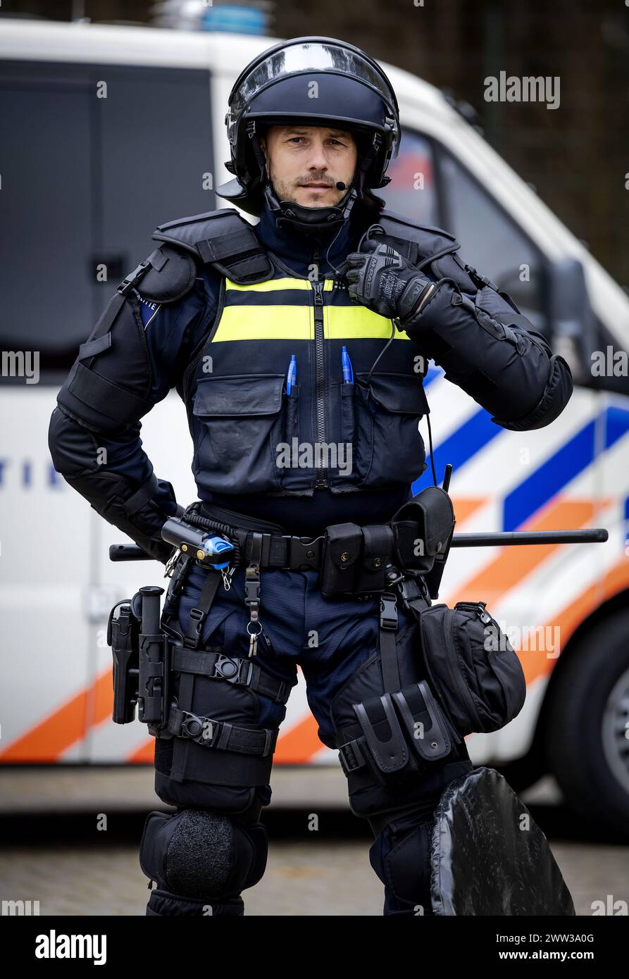OSSENDRECHT - A fully equipped riot police officer during the ...