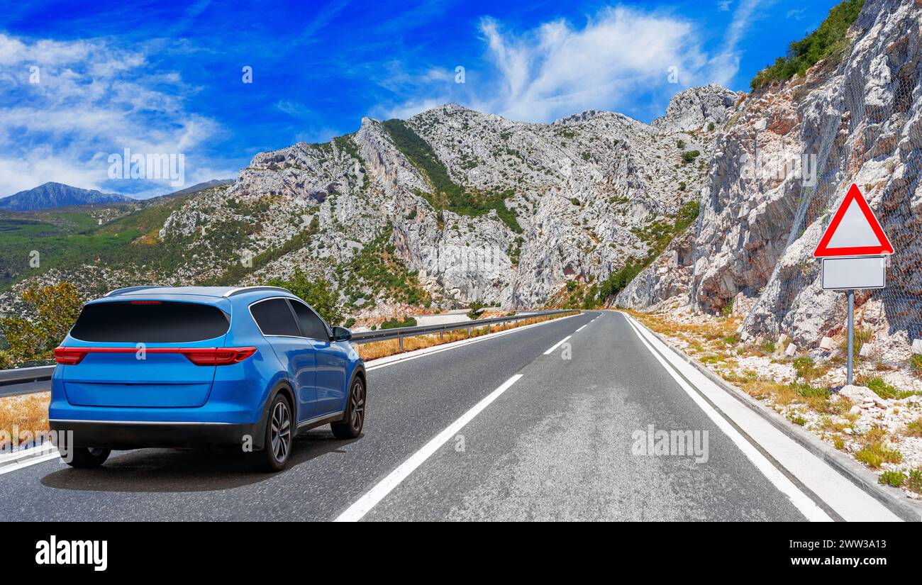 Blue car on asphalt road Stock Photo - Alamy