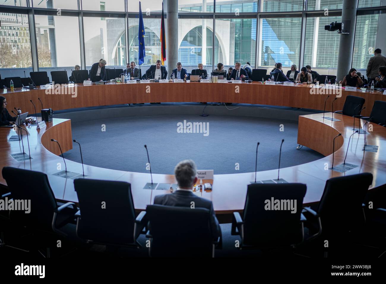 Berlin, Germany. 21st Mar, 2024. Committee members gather for a public ...