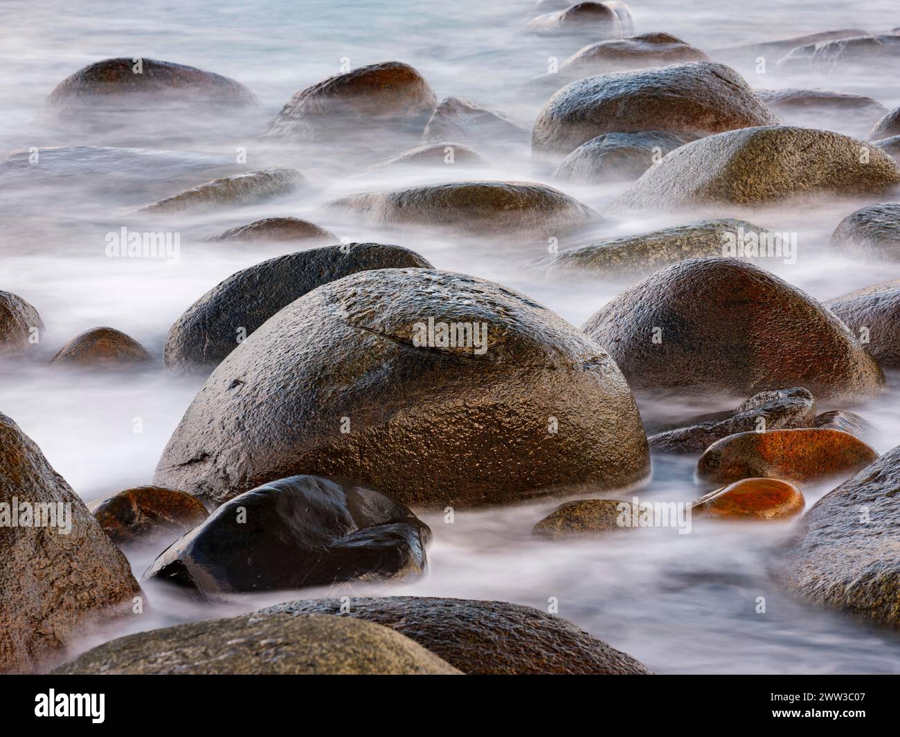 Close-up, rounded rocks on the beach at Utakleiv, Vestvagoya, Lofoten ...