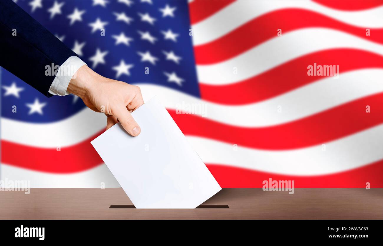 USA presidential elections. Hand holding ballot in voting ballot box ...