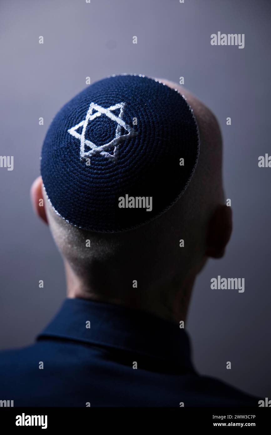 Jewish man wearing a kippa with a Star of David on his head, back view ...