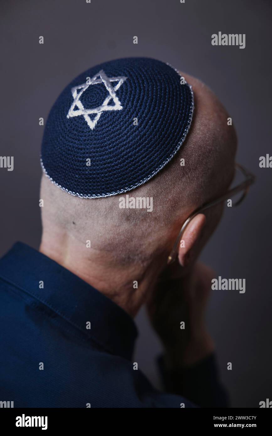 Jewish man wearing a kippa with a Star of David on his head, back view ...