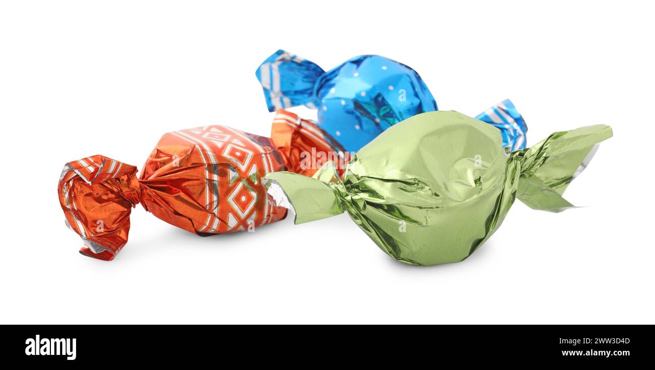 Sweet candies in colorful wrappers on white background Stock Photo - Alamy