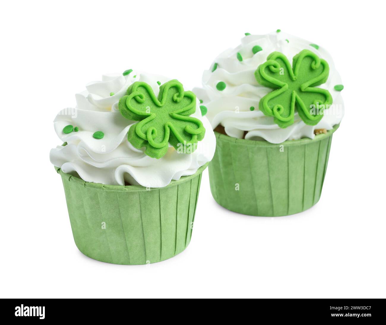 St. Patrick's day party. Tasty cupcakes with green clover leaf toppers ...