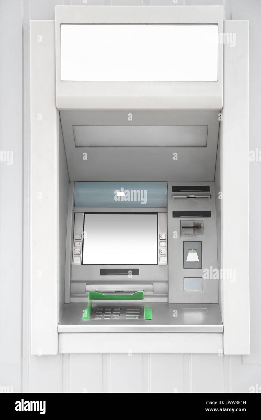 Modern automated cash machine with screen outdoors Stock Photo - Alamy