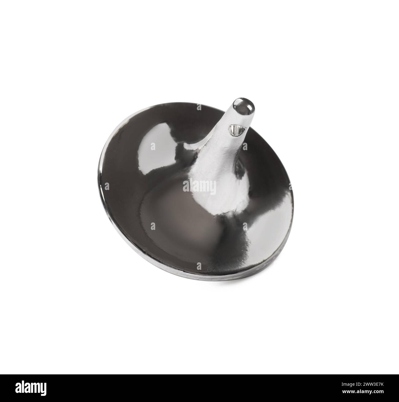 One silver spinning top on white background Stock Photo - Alamy