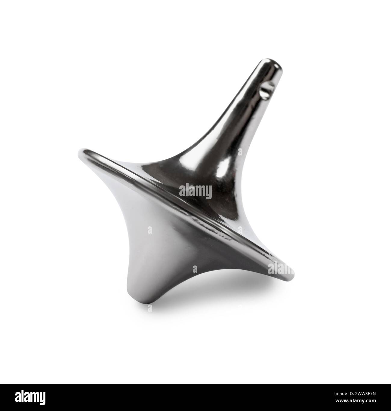 One silver spinning top on white background Stock Photo - Alamy