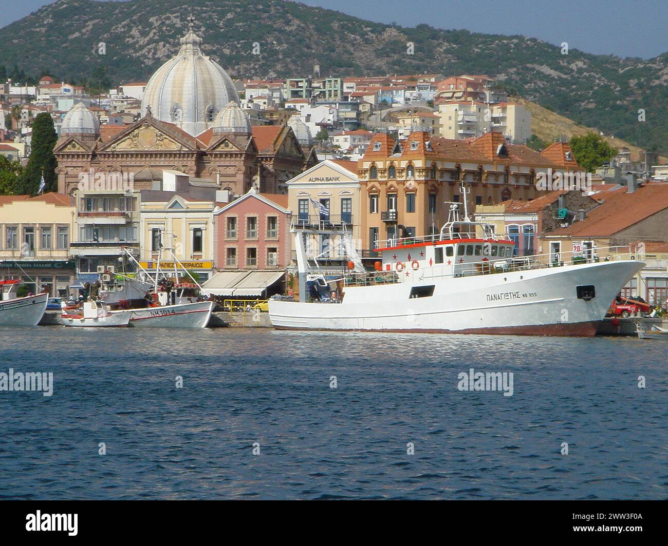 View of a coastal town with historic buildings and boats in front of a ...