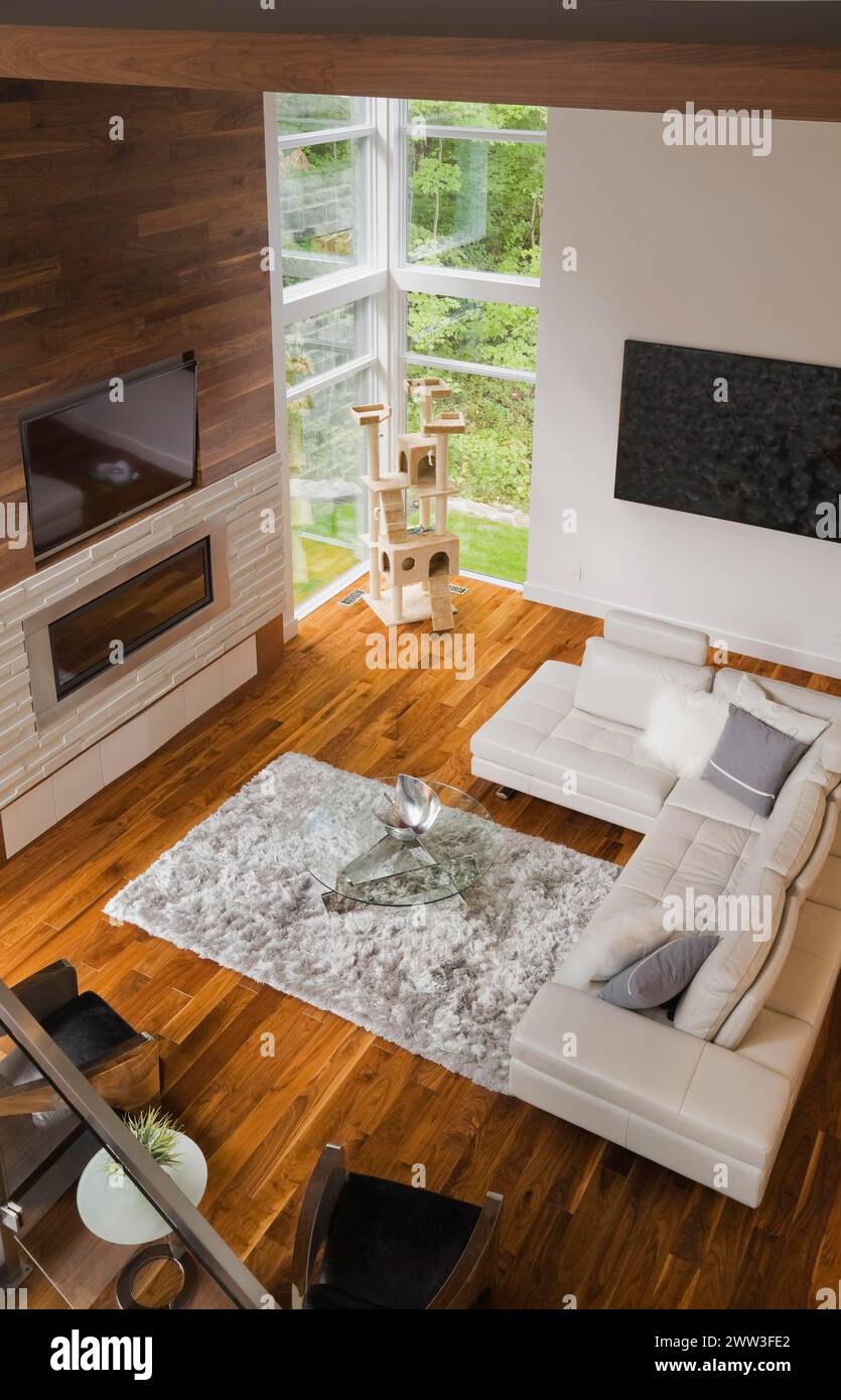 High angle view of living room with creamy beige colored L-shaped ...