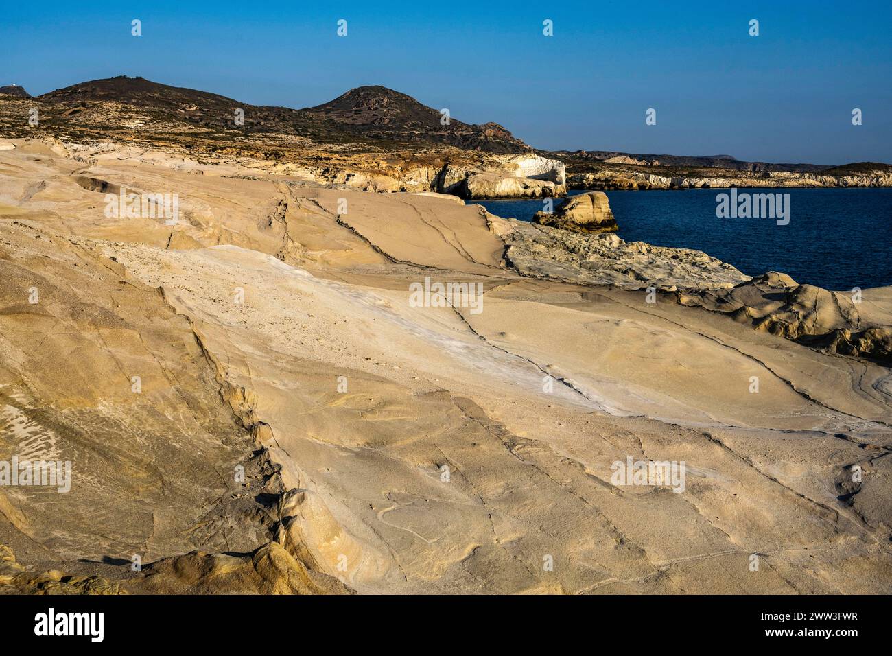 White rocks in the evening light on the coast near Sarakinikoer, Milos ...