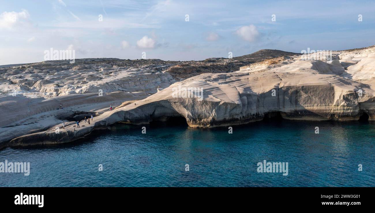 Tourists on the white rocks on the coast near Sarakinikoer, Milos ...
