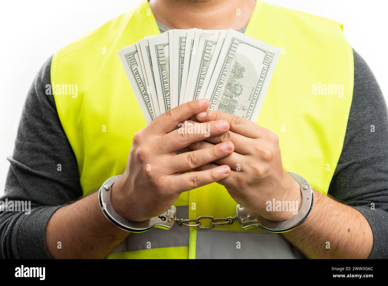 Close-up of corrupted arrested constructor man in handcuffs wearing ...