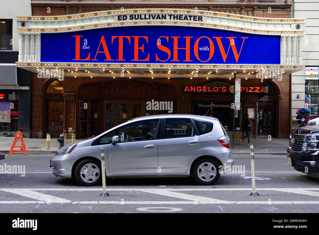 The illuminated exterior facade of the Ed Sullivan Theatre with the ...