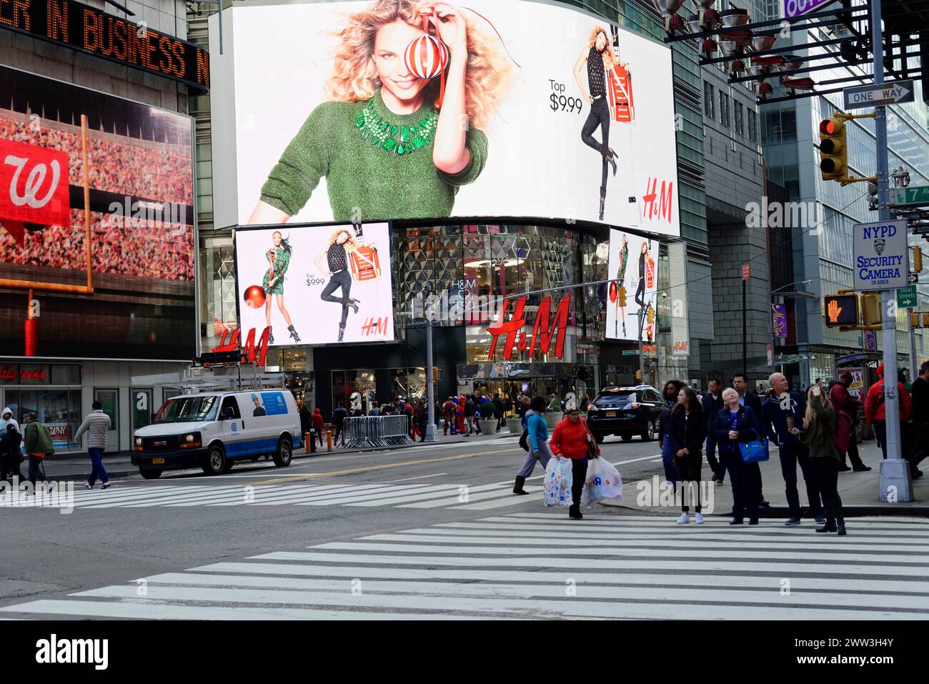 Vibrant view of Times Square with large billboards and a crowd on the ...