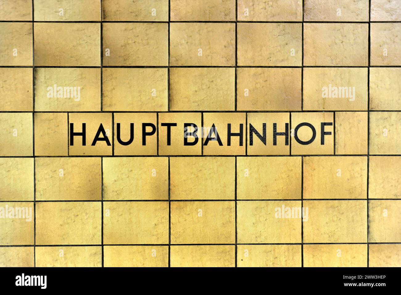 Yellow wall tiles with the lettering 'central railway station' on a ...