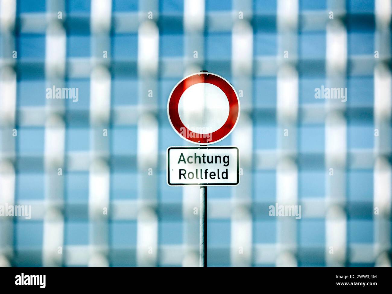 Warning sign with the inscription Achtung Rollfeld at Frankfurt Airport ...