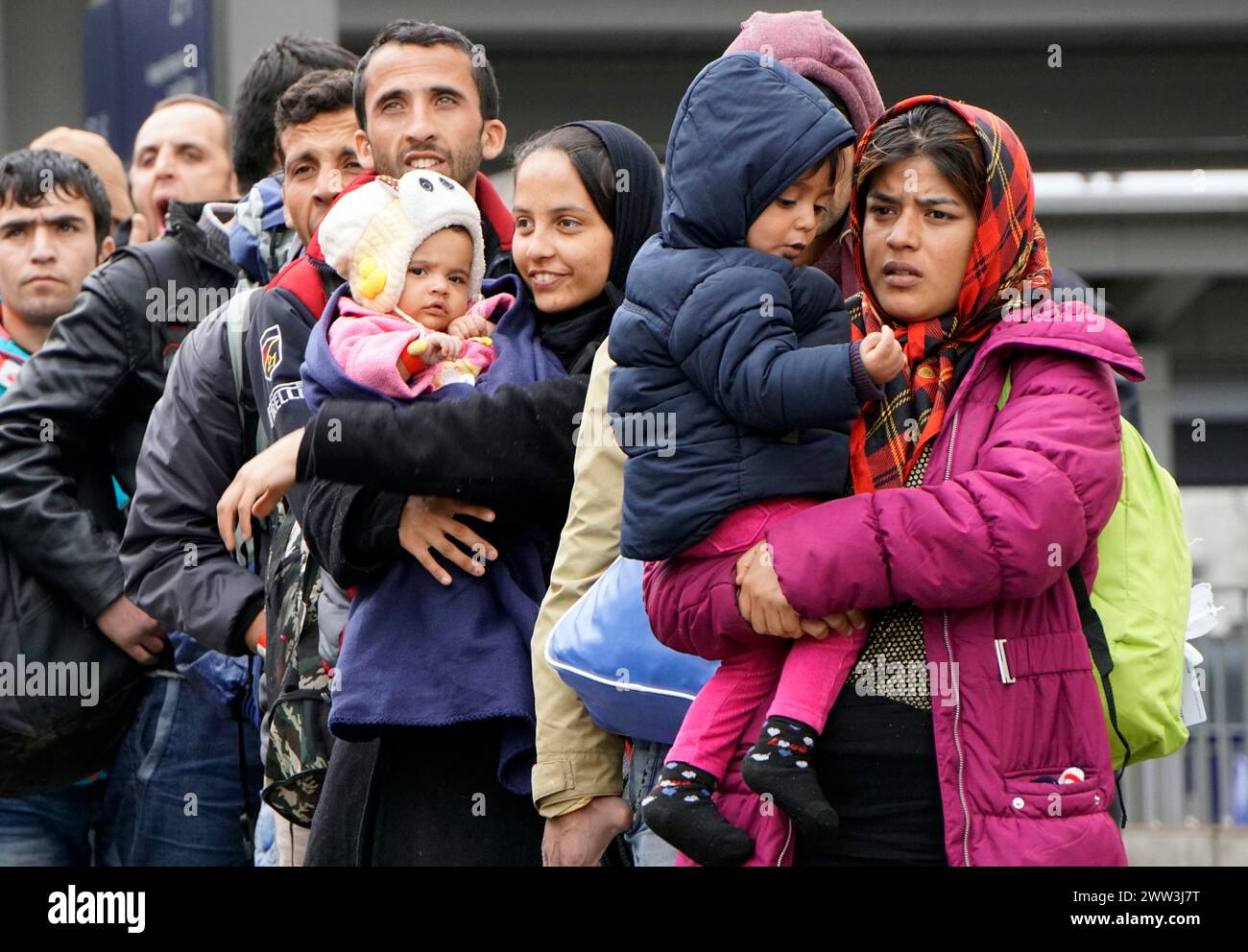 Refugees arriving at Rosenheim station, being taken to registration by ...