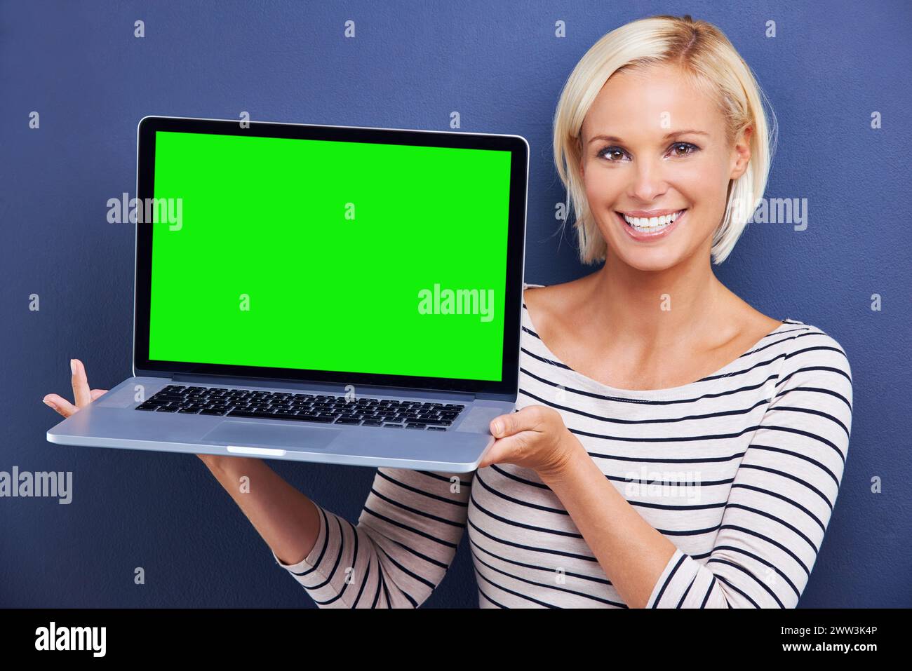 Portrait, green screen and woman with a laptop, connection and internet ...