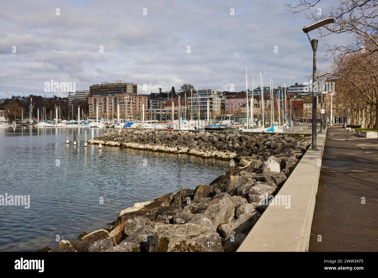 Lake Geneva waterfront promenade with view of Ouchy harbour in the ...