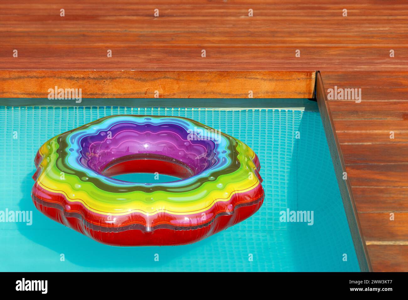 Colorful inflatable ring on the surface of the swimming pool Stock ...
