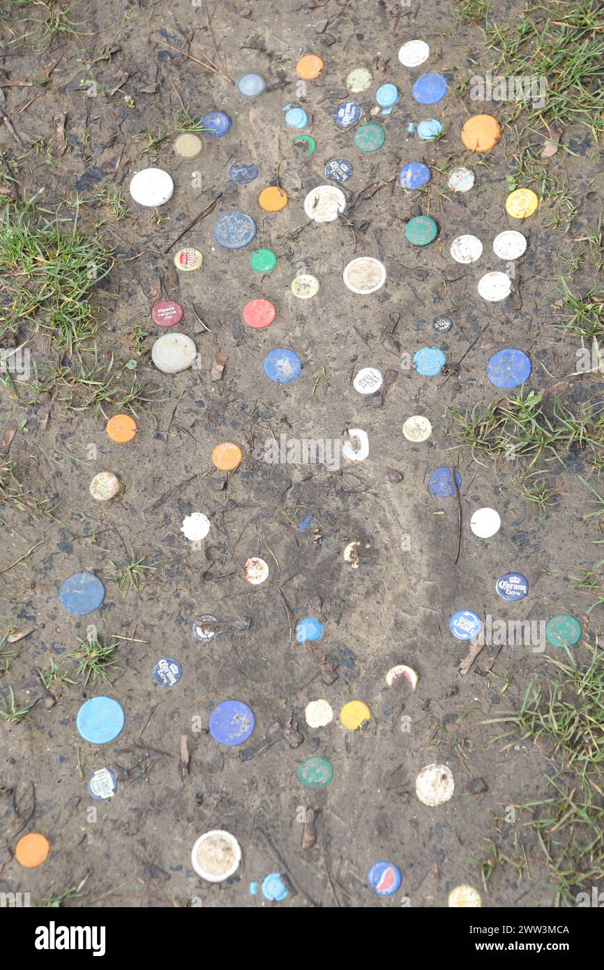 Plastic bottle tops pressed into mud and metal bottle tops Stock Photo ...