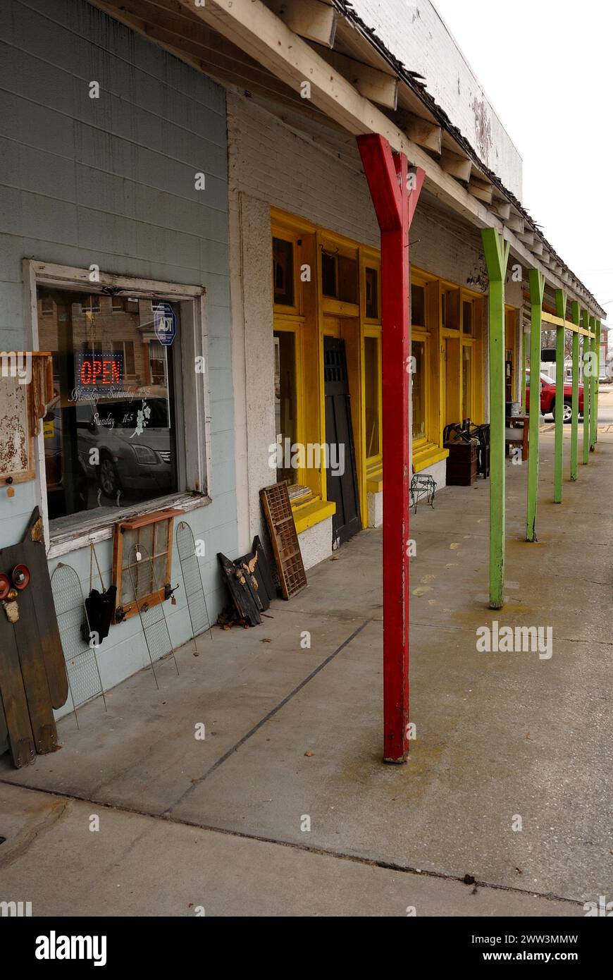 covered sidewalk shopping in rural area with antique stores in ...