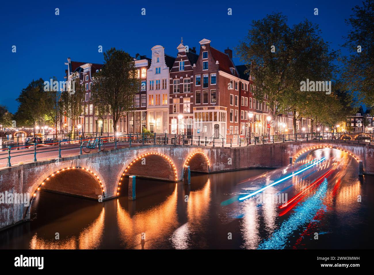 Amsterdam's Twilight: Lights and Reflections in the Historic Canal ...