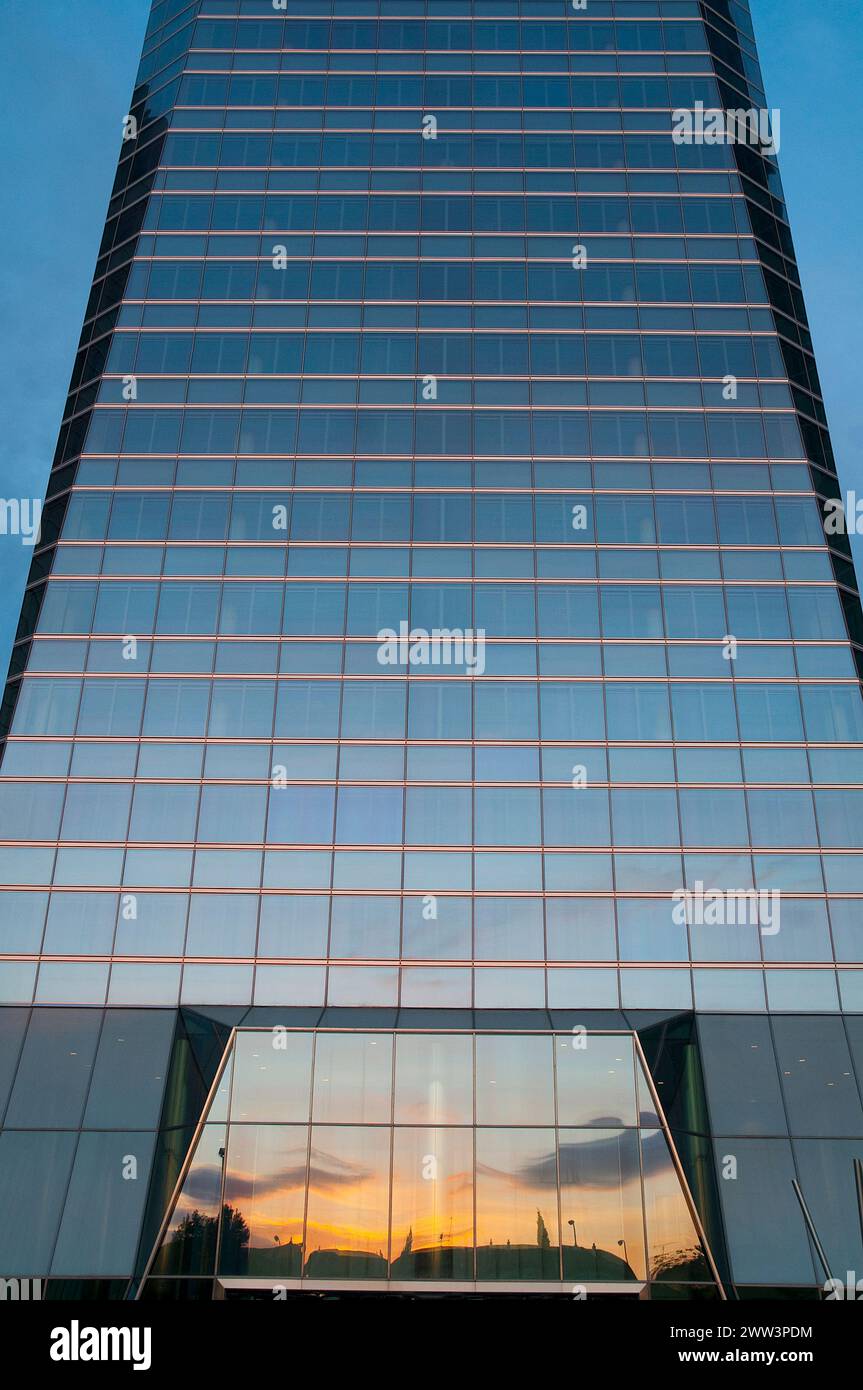 Glass facade of Cristal Tower at dawn, close view. Paseo de la ...