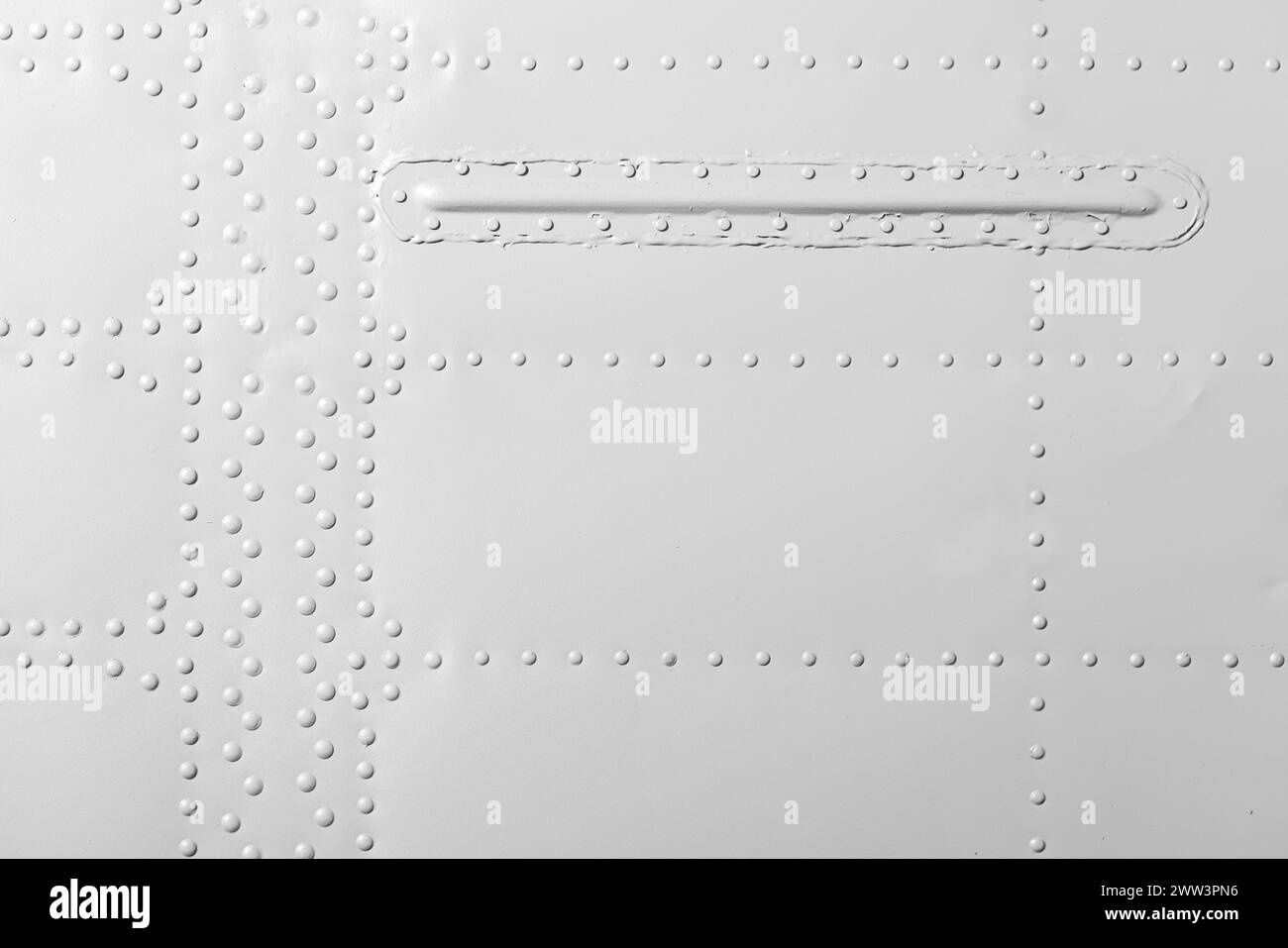 White industrial metal wall with rivets pattern, front view, background ...