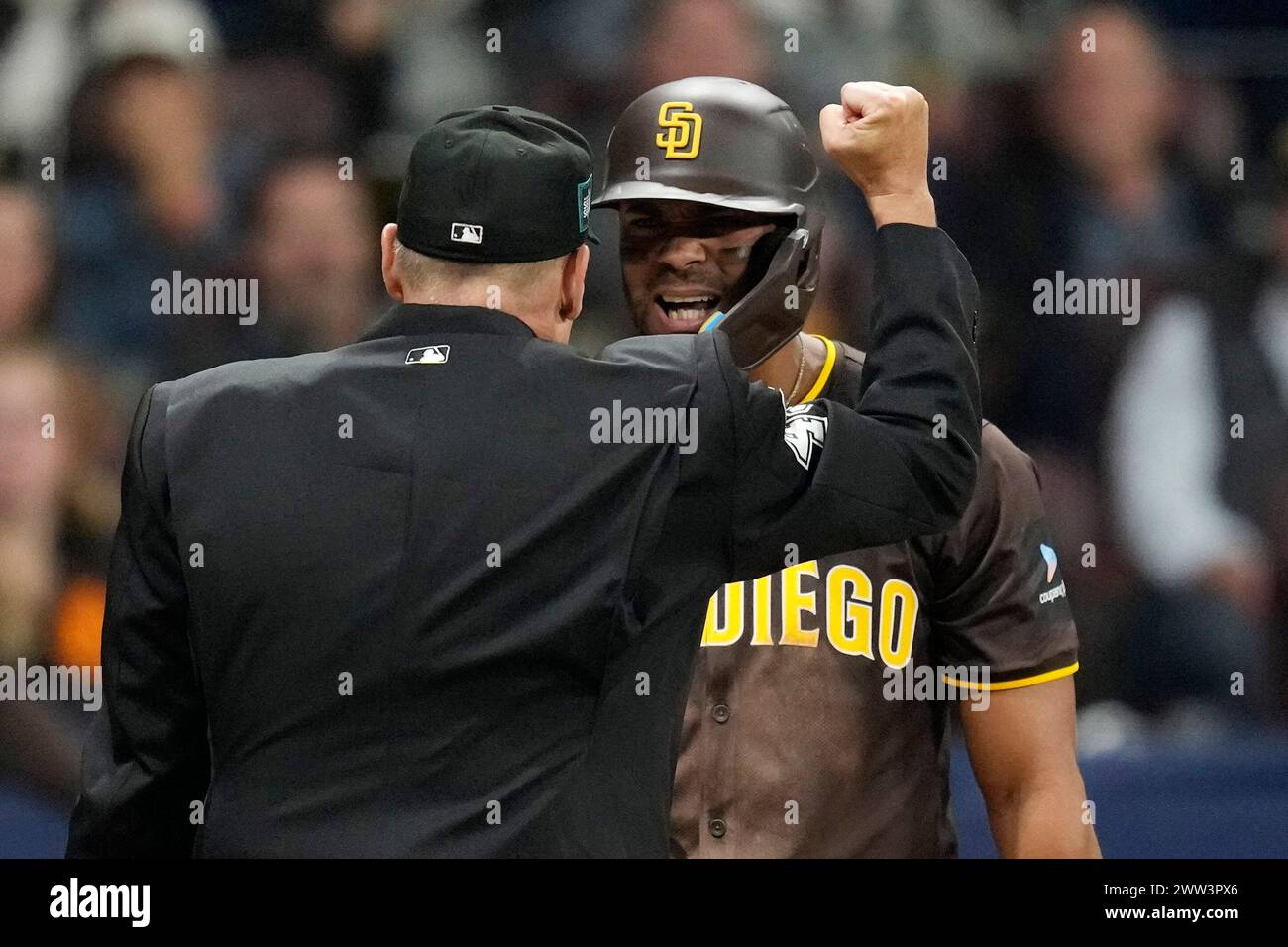 San Diego Padres' Xander Bogaerts, right, argues with home plate umpire ...